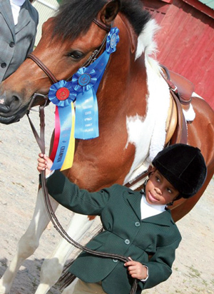 Eight year old equestrian jumps to new heights