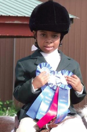Eight year old equestrian jumps to new heights