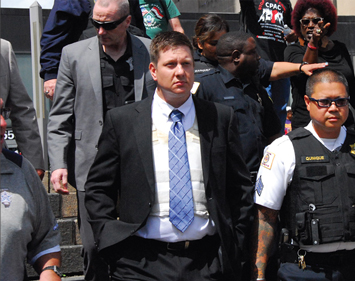 Trial of accused 'killer cop' opens and tension mounts